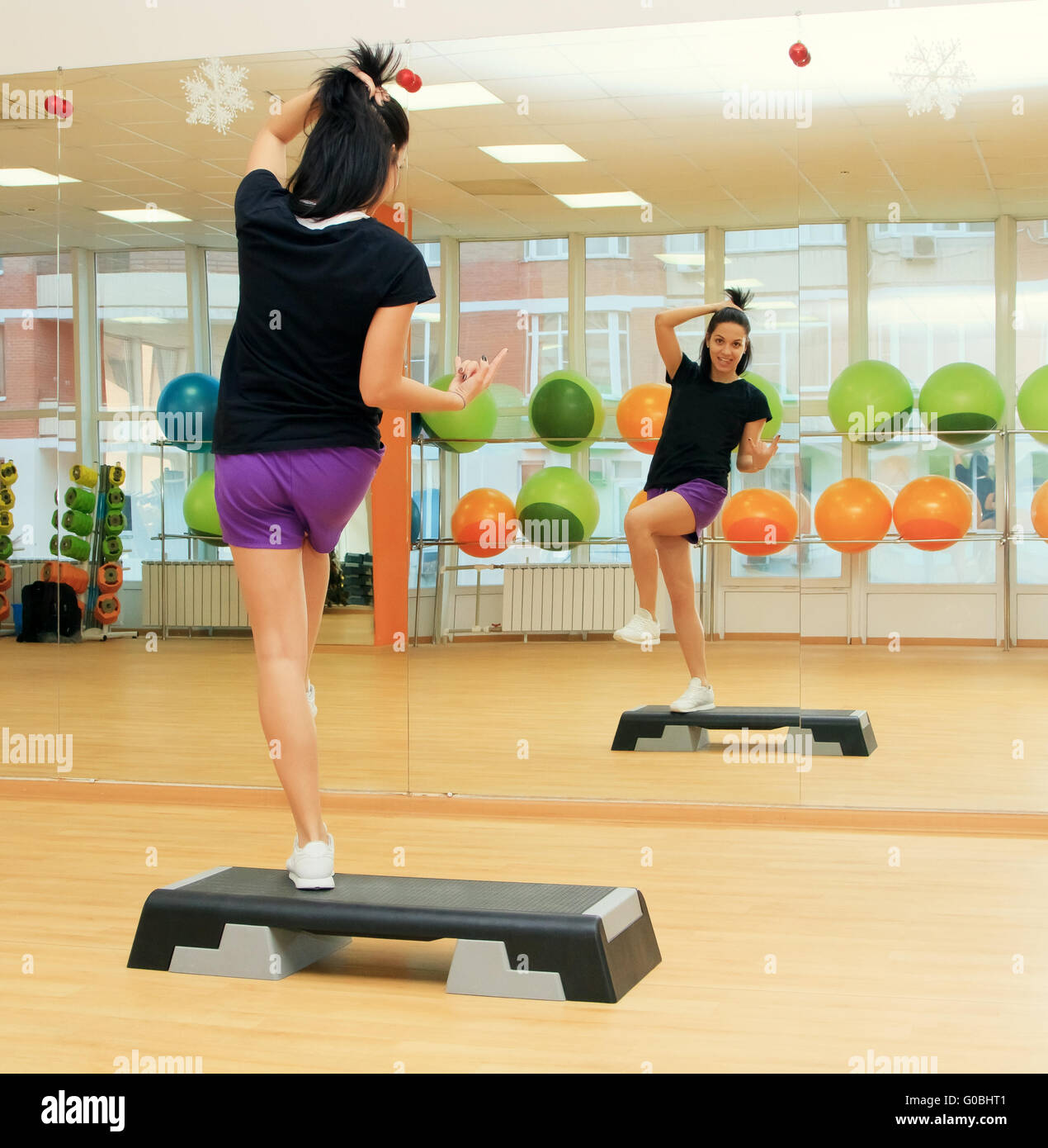 Beautifull female on the step board during exercise Stock Photo - Alamy
