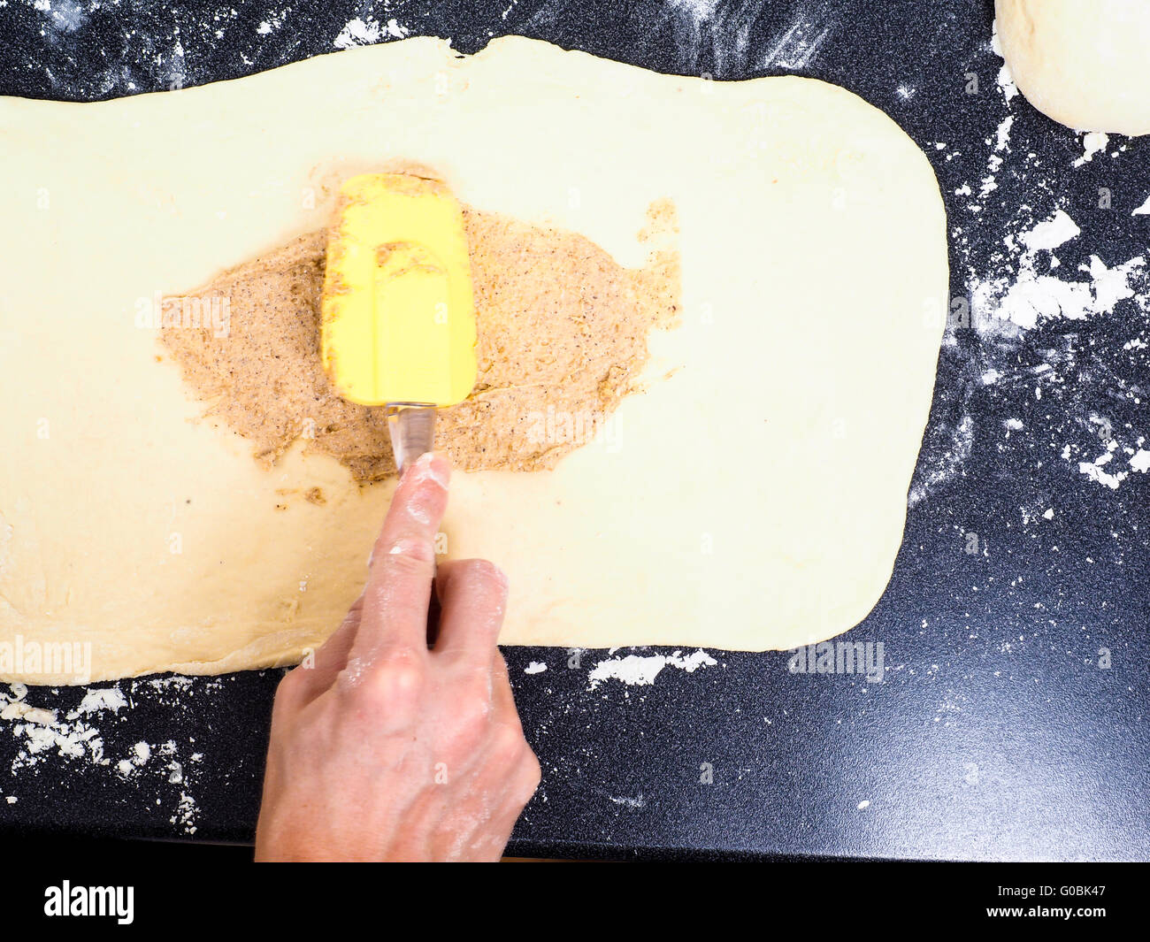 Baker spreading dough on table hi-res stock photography and images - Alamy