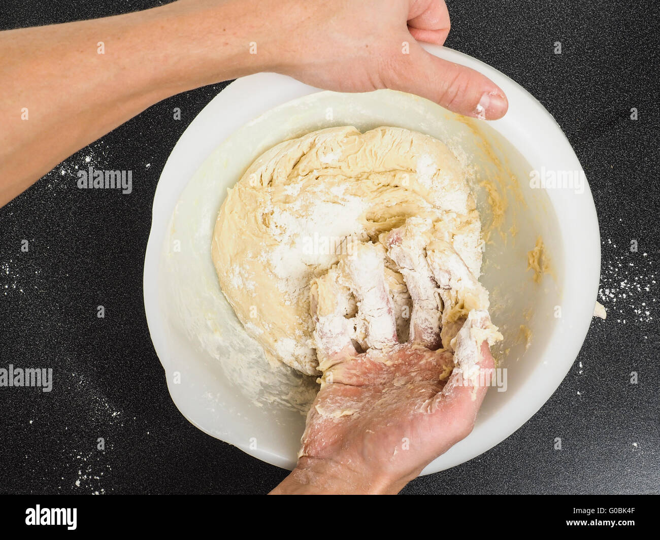 Hands kneading dough Stock Photo - Alamy