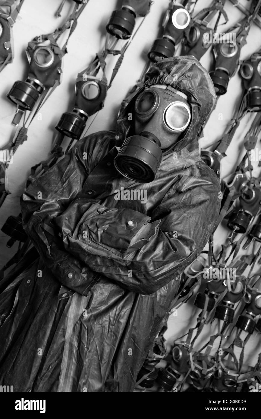Photo of a man in WWII's clothes and gas mask Stock Photo - Alamy