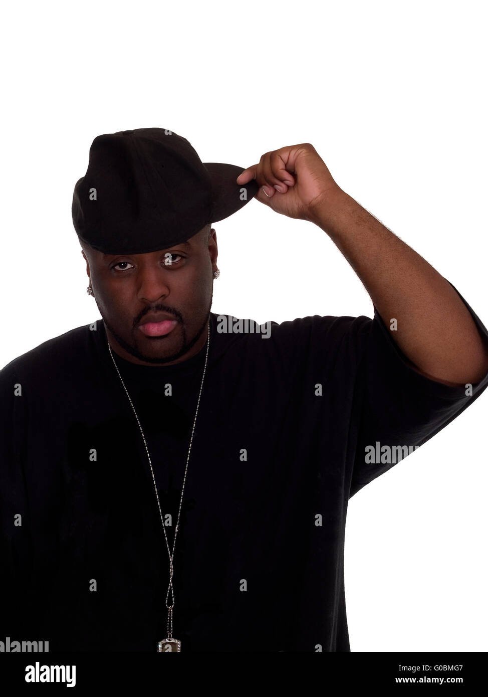 Young Black Man Wearing Cap with Hand to Bill Stock Photo - Alamy