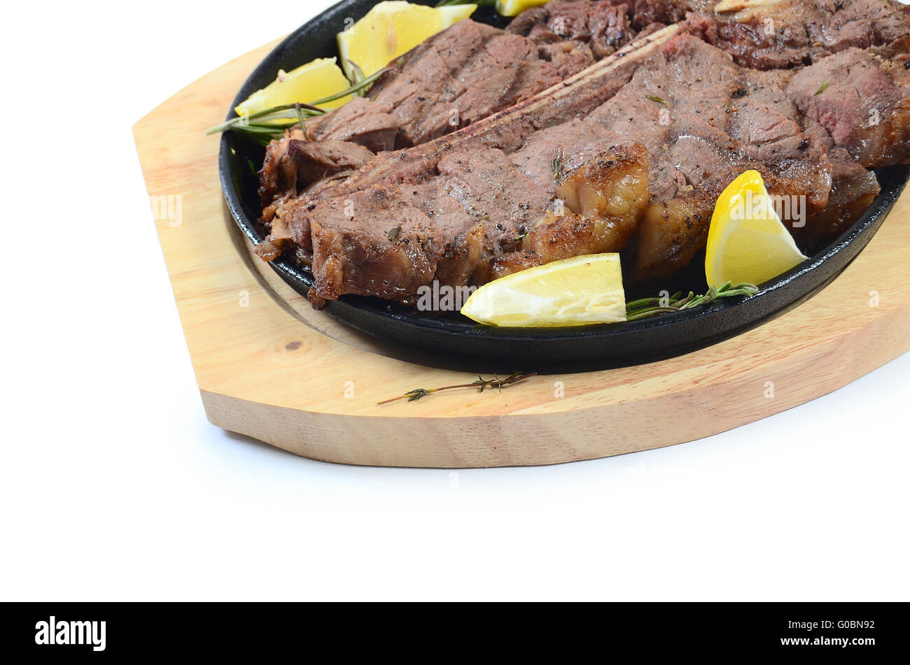 Stake from mutton with a lemon Stock Photo - Alamy