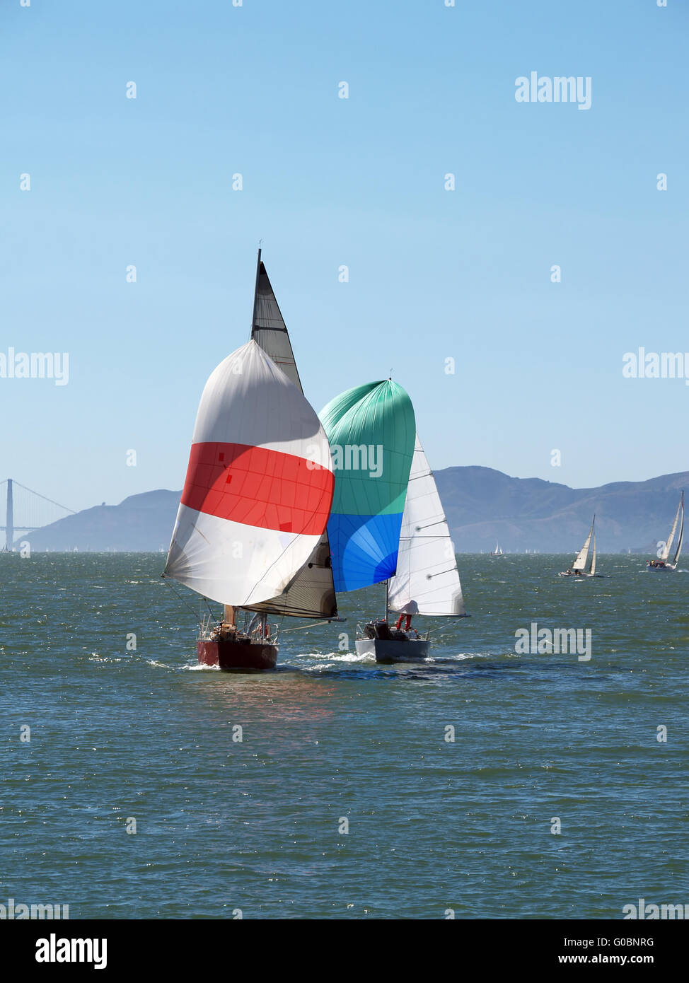 two sailboats under sail on the bay spinnaker Stock Photo - Alamy