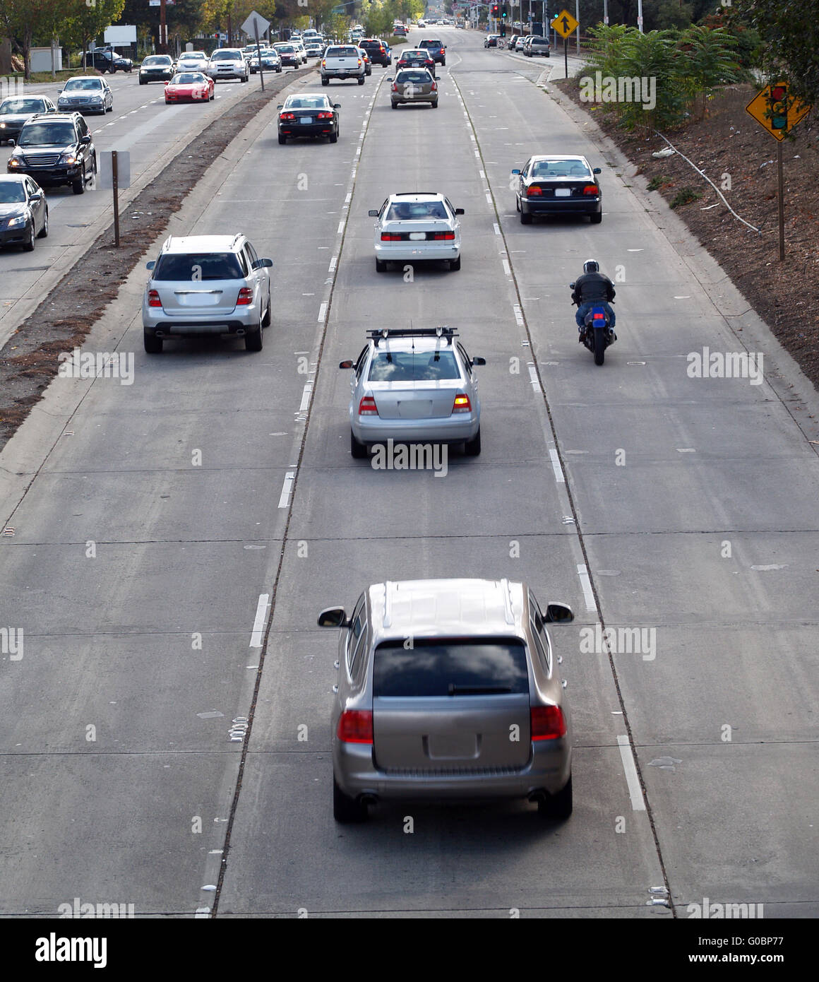 cars and motorcycles on city street from above Stock Photo - Alamy