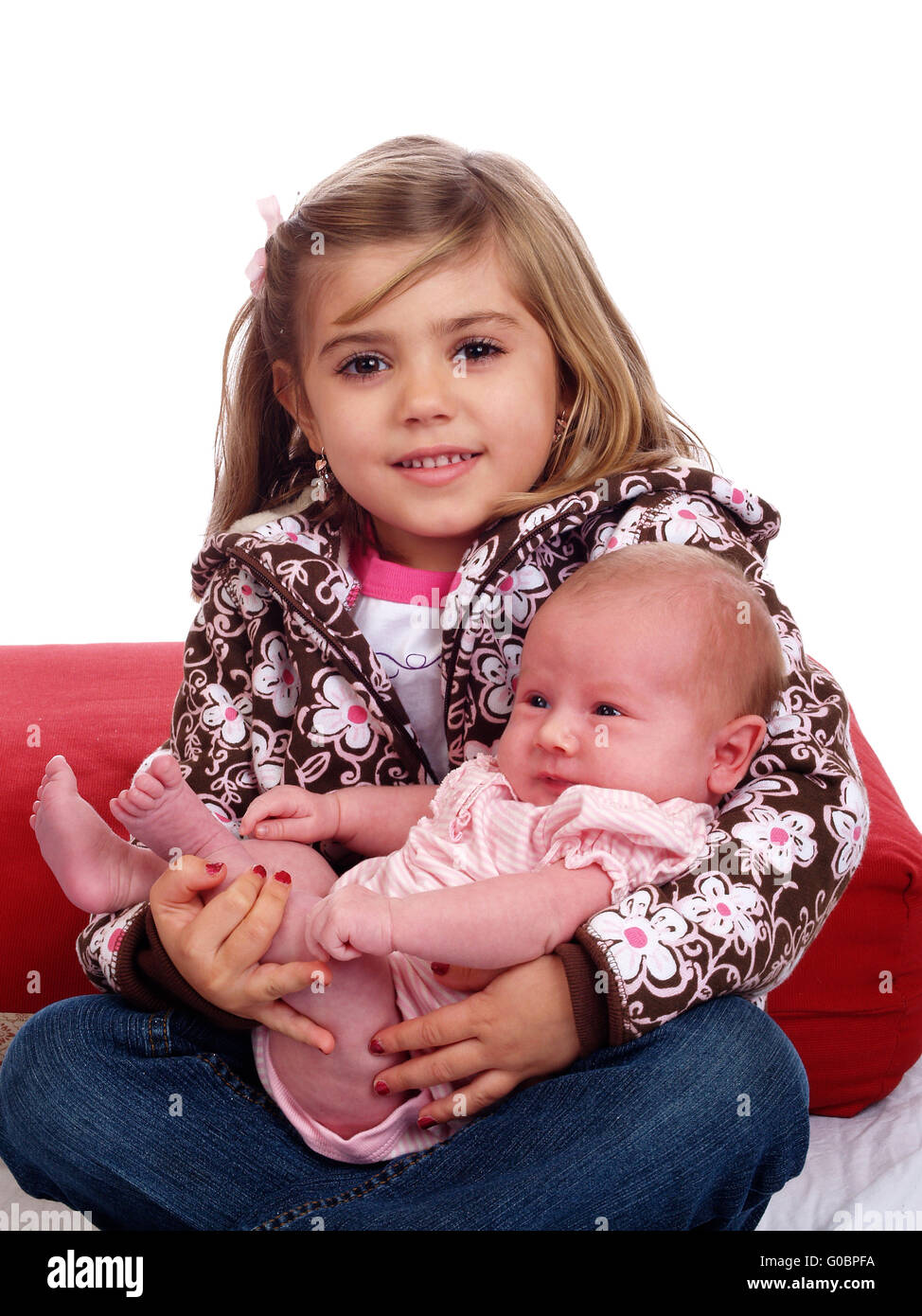 Cute Young Girl Holding Infant Baby in Lap Stock Photo - Alamy