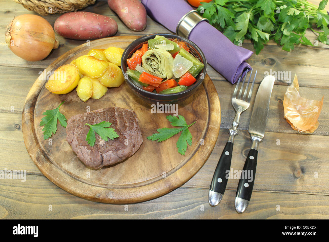 roasted ostrich steak with baked potatoes Stock Photo - Alamy