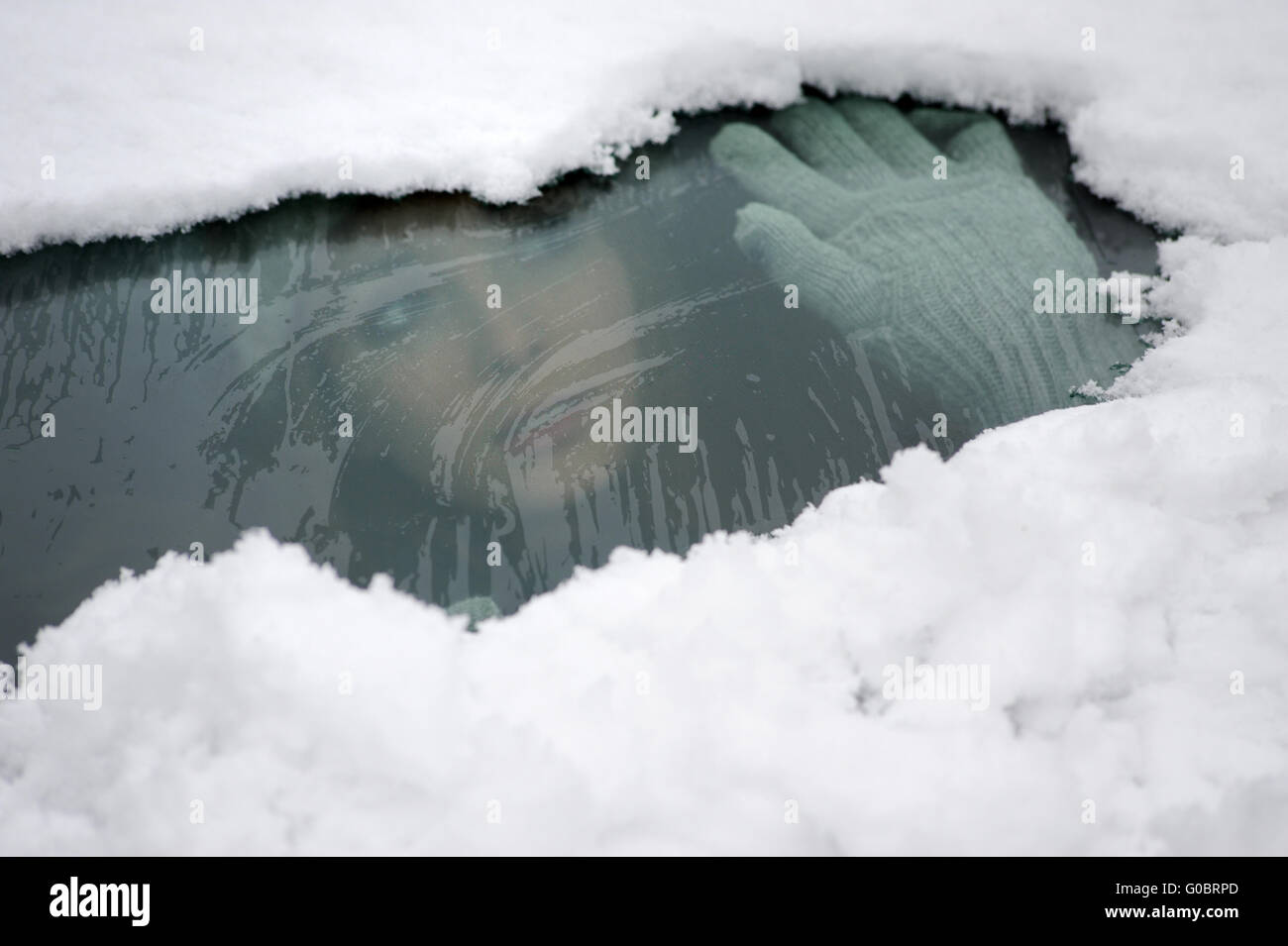 Young female looking through a snowy front shield Stock Photo - Alamy