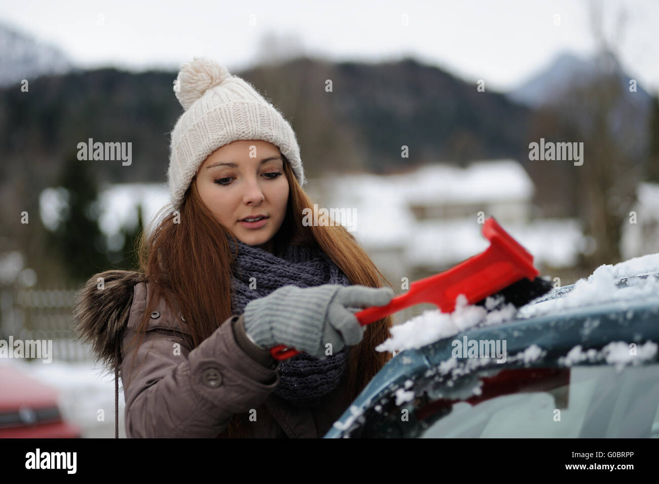 Woman sweeps snow hi-res stock photography and images - Alamy