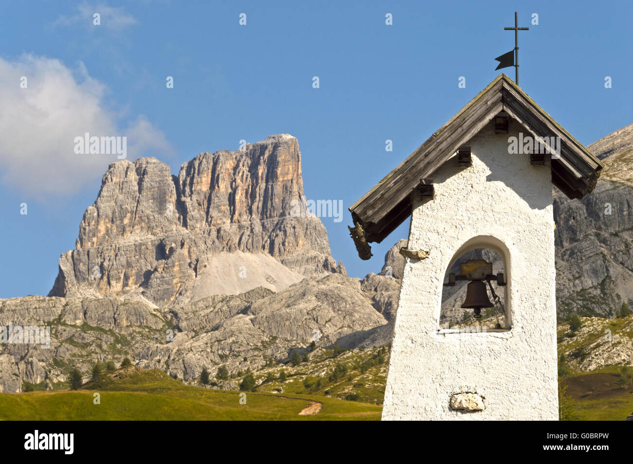 bell tower with landscape of the italians mountains background in a ...