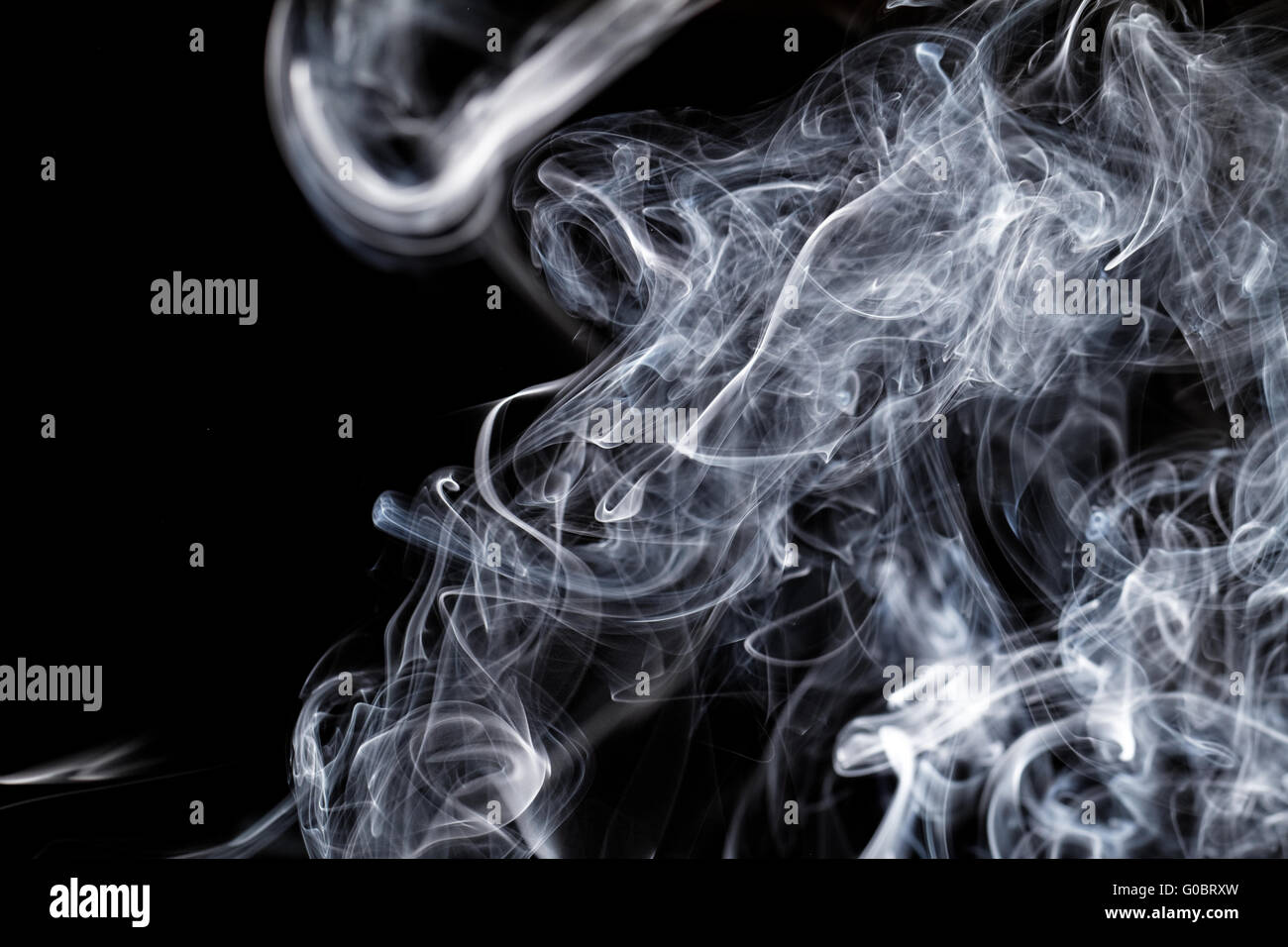 Beautiful smoke on the black background - macro photo Stock Photo - Alamy