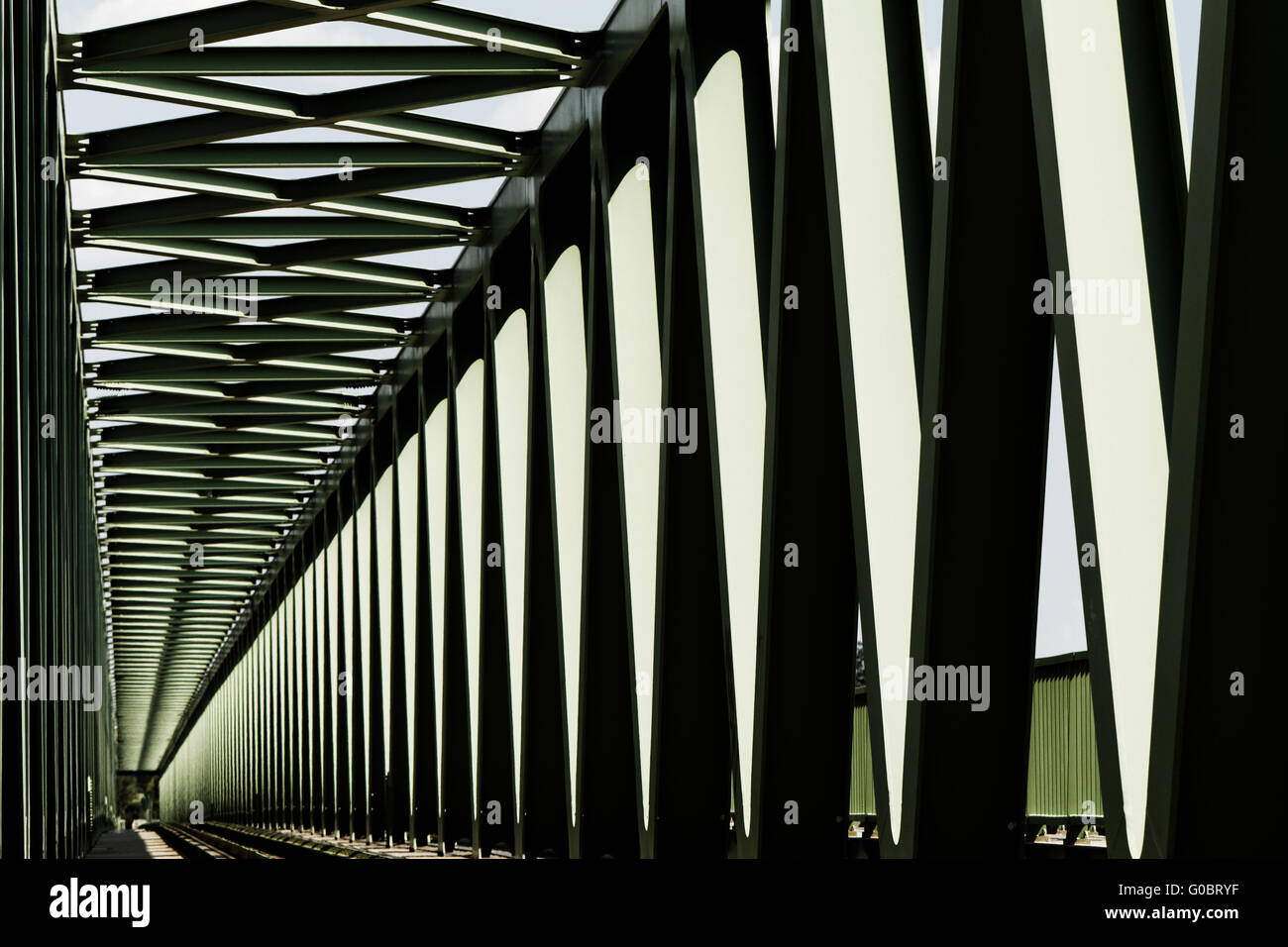Railway metal bridge perspective view Stock Photo - Alamy
