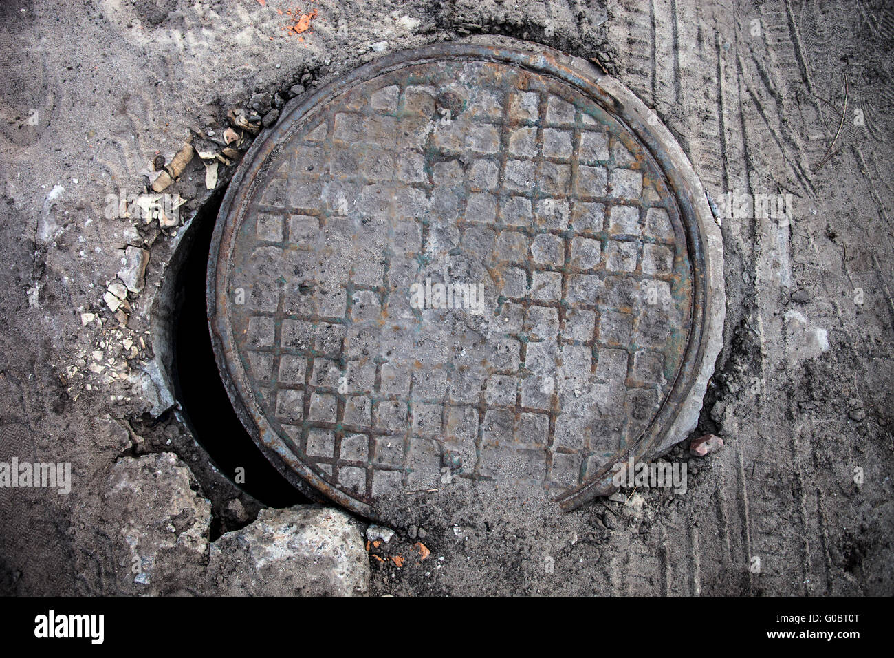 Open manhole with metal cover Stock Photo - Alamy