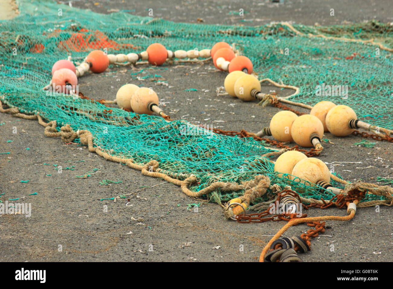 Fishing nets spread on the ground Stock Photo - Alamy