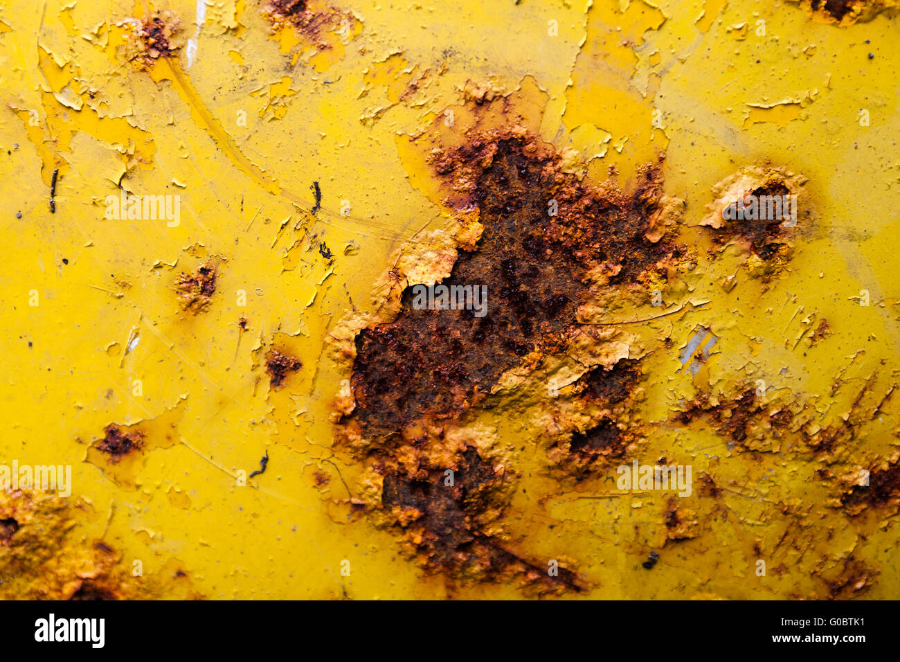 Yellow painted old metal surface with rust Stock Photo - Alamy