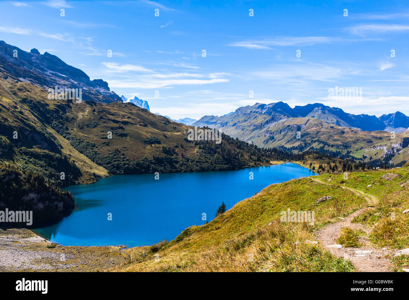 Aerial view of Engstlensee lake and the Alps on a sunny day on Bernese ...