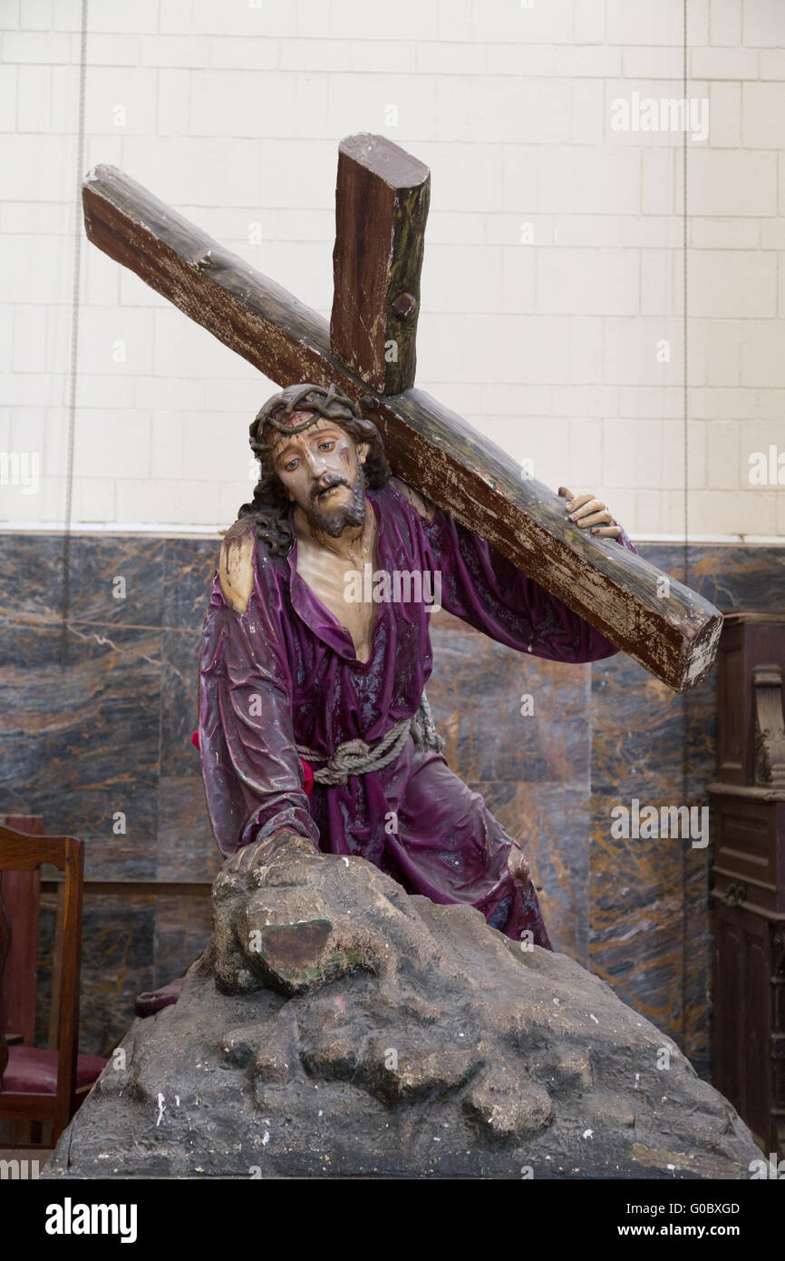 Statue of Jesus Christ holing a cross Stock Photo - Alamy