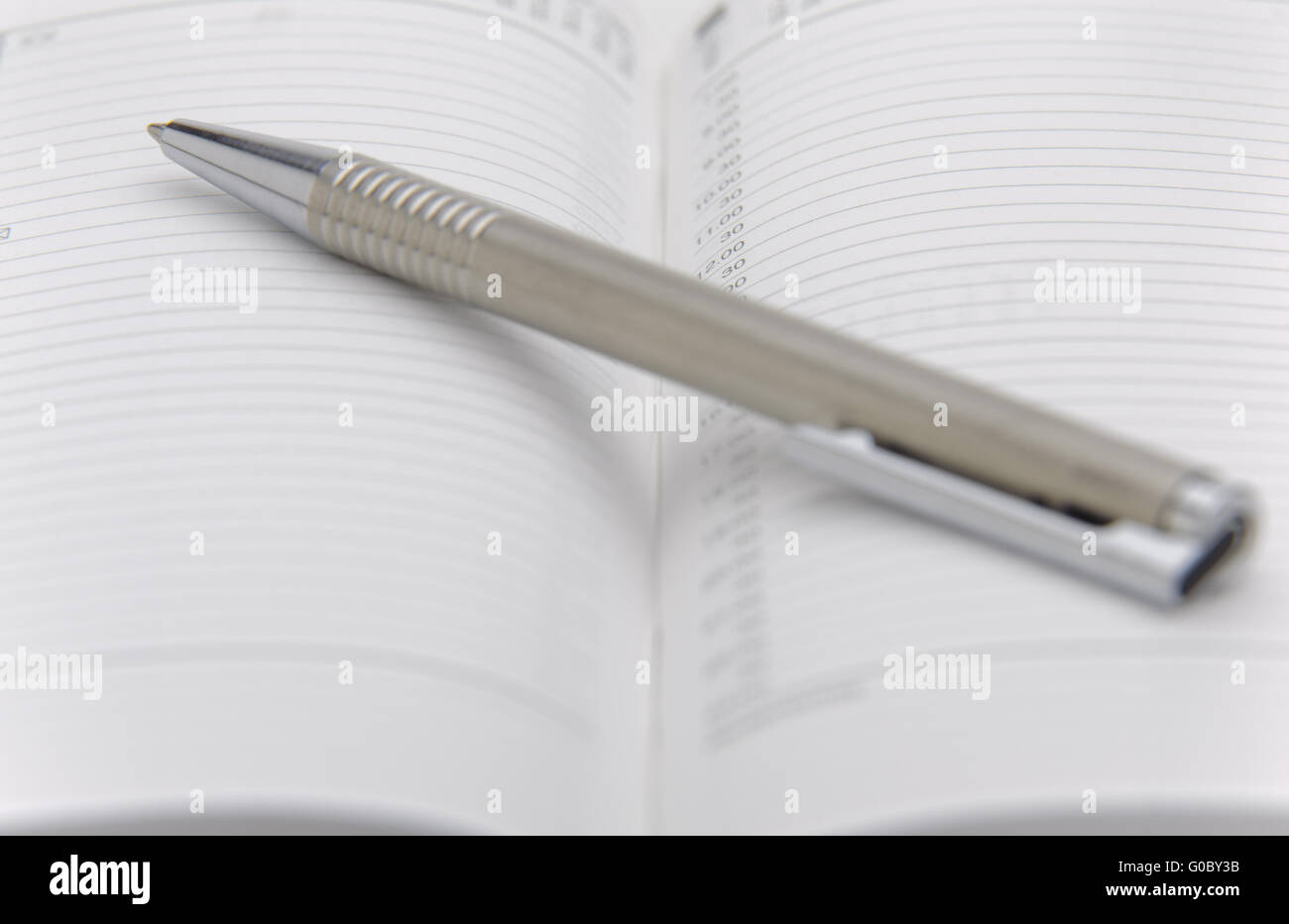 blank time planner with pen Stock Photo - Alamy