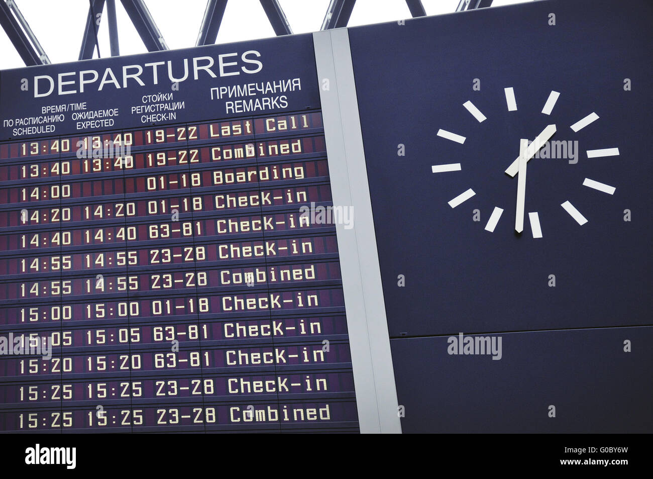 big timetable board with watches and departure time lines Stock Photo ...