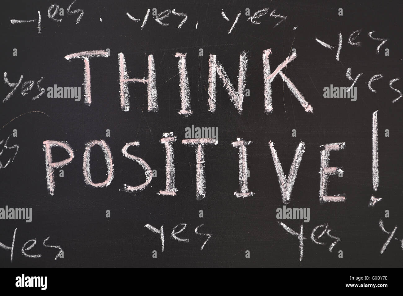 think positive concept handwritten on black chalkboard Stock Photo - Alamy