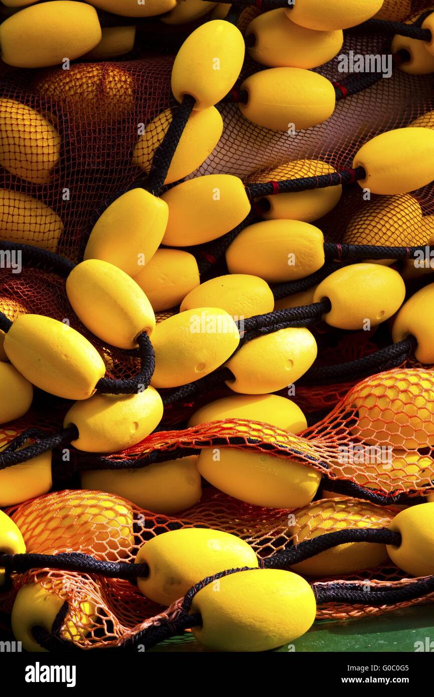 fishing nets on the vessel rolled Stock Photo - Alamy