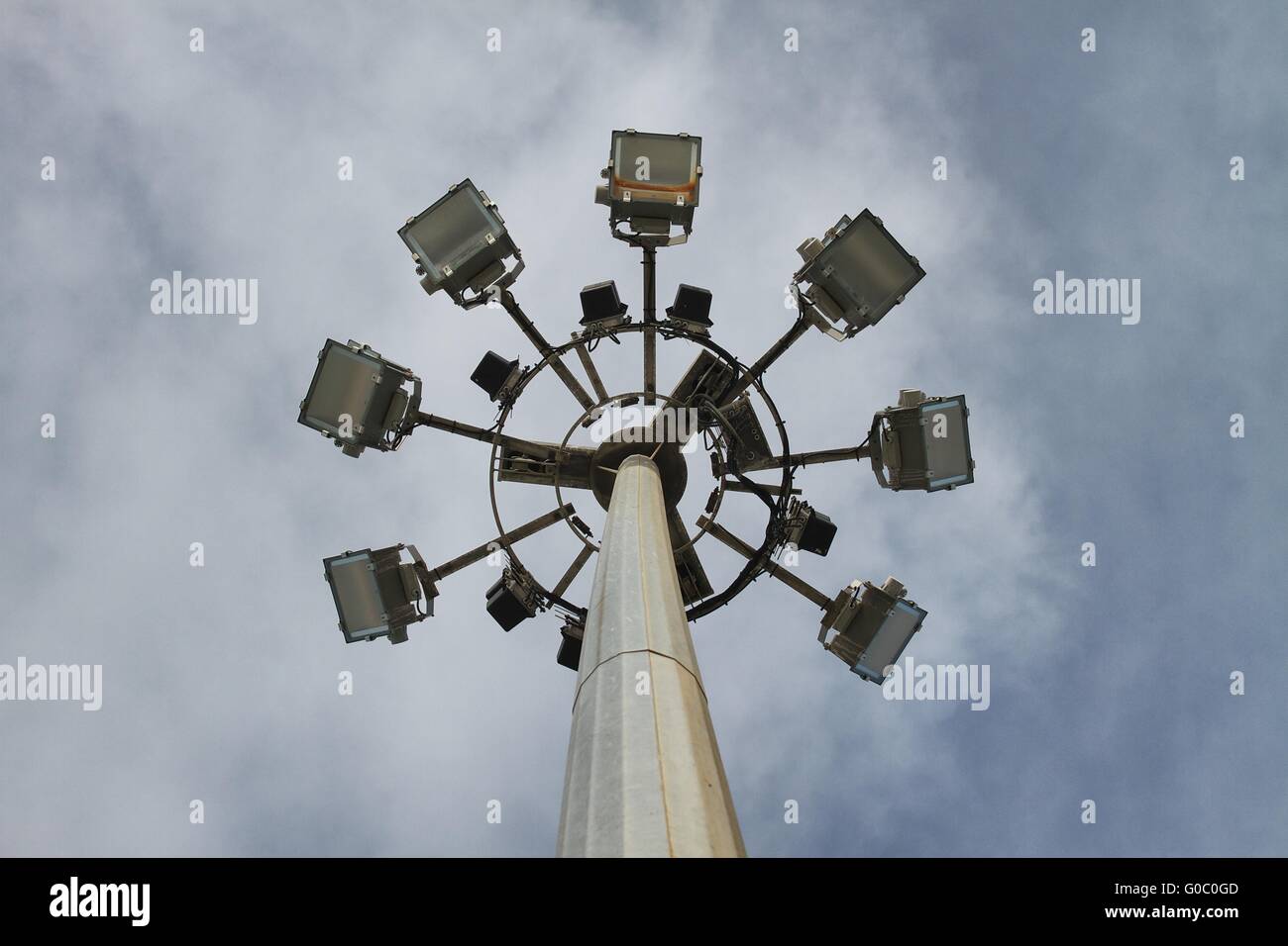 Big spotlight pole on blue sky background Stock Photo - Alamy