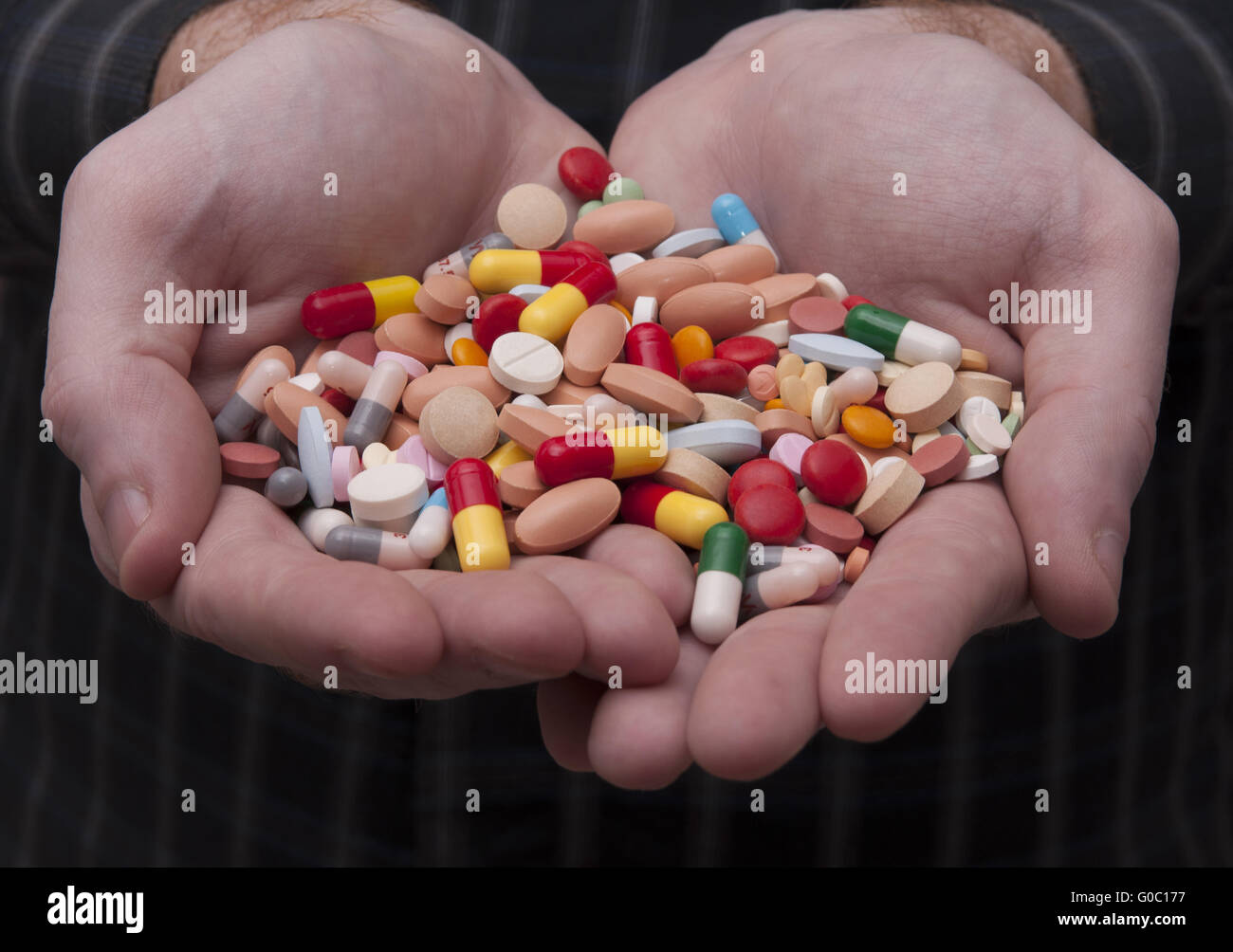 Caucasian Man Holding a Bunch of Pills and Capsule Stock Photo - Alamy