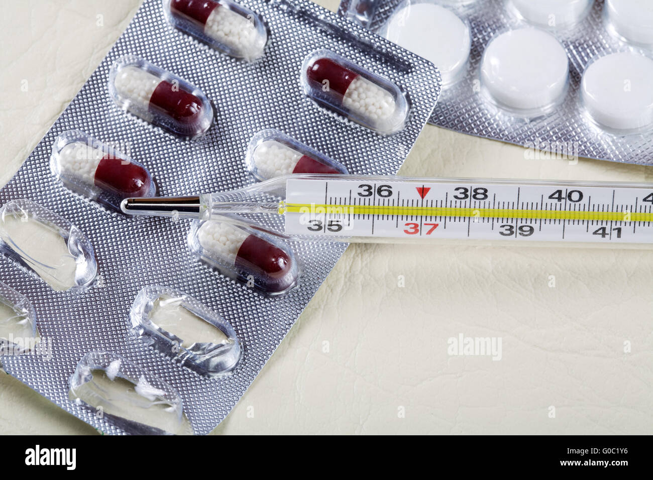 The medical thermometer and medicines in tablets Stock Photo - Alamy