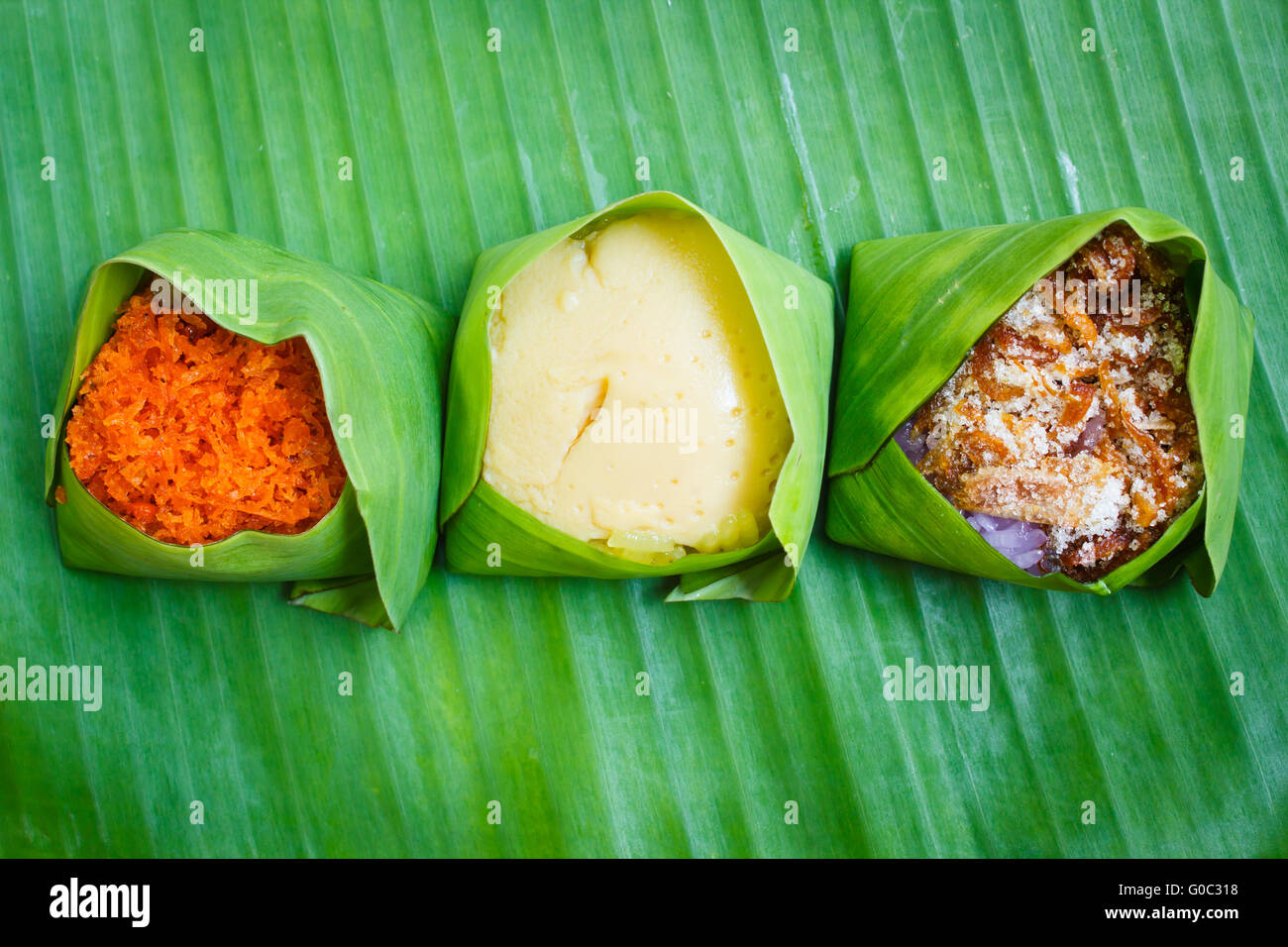 Thai Traditional Dessert, Sticky rice custard wrapped in banana leaves ...