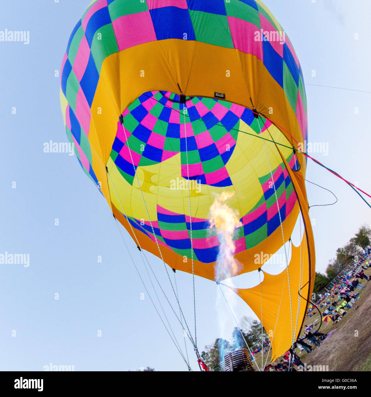 Fire heats the air inside a hot air balloon at balloon festival Stock ...