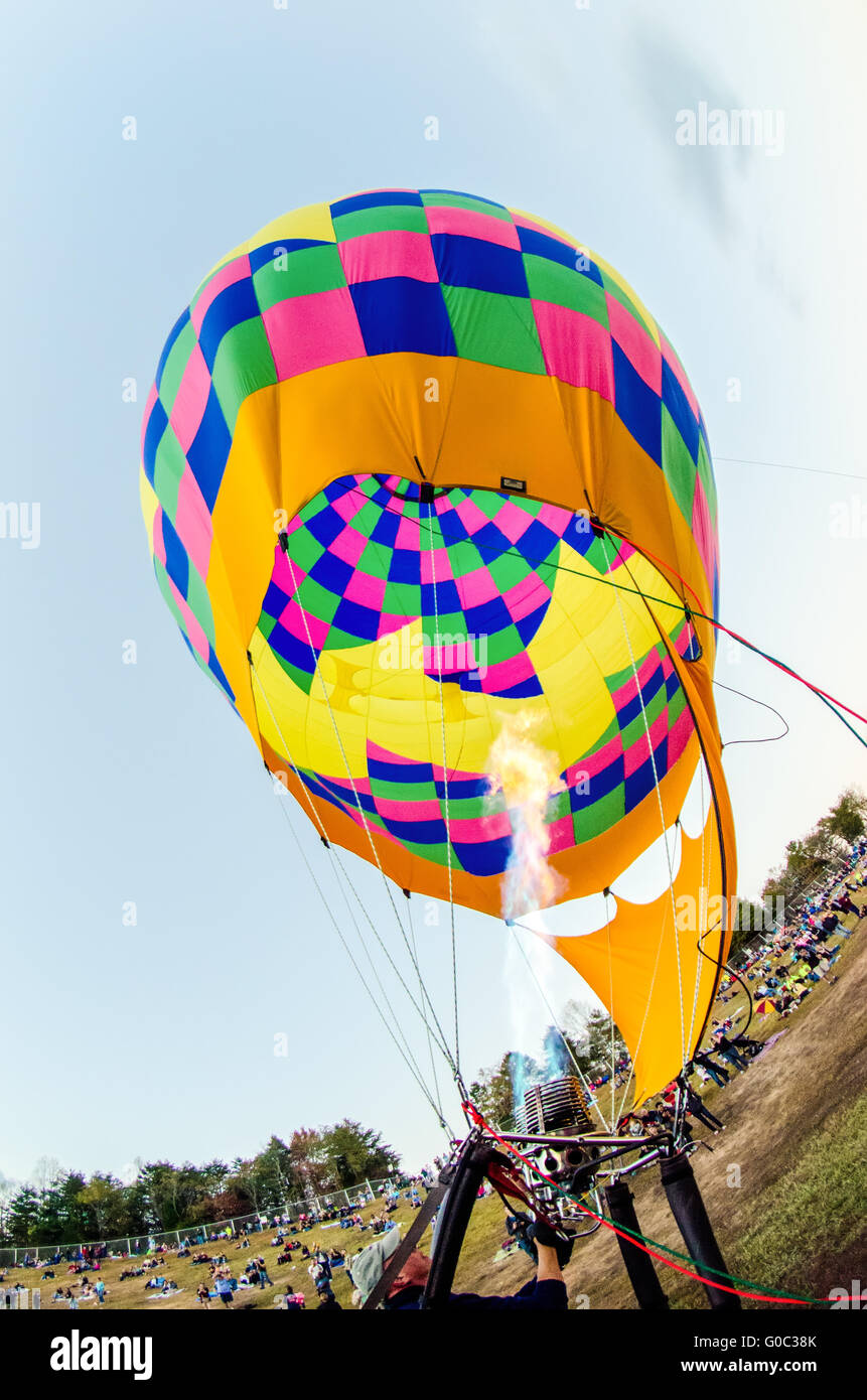 Fire heats the air inside a hot air balloon at balloon festival Stock ...