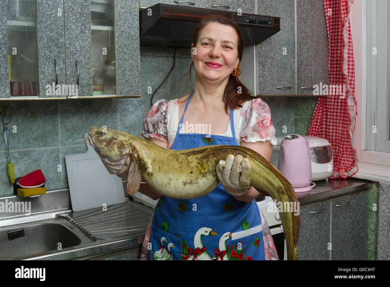 Woman with fish Stock Photo - Alamy