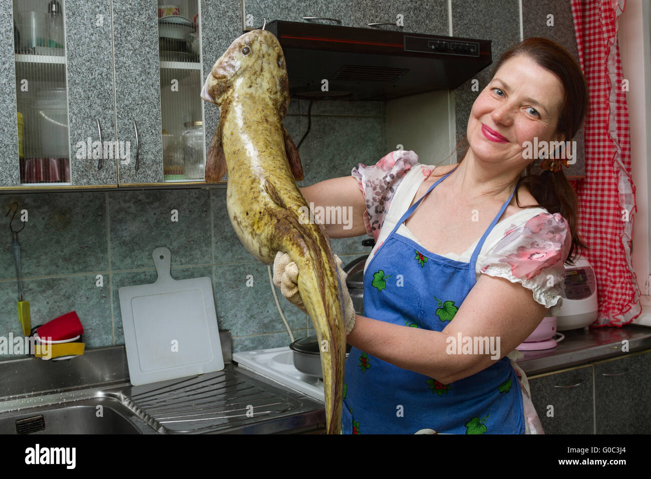Woman with fish Stock Photo - Alamy