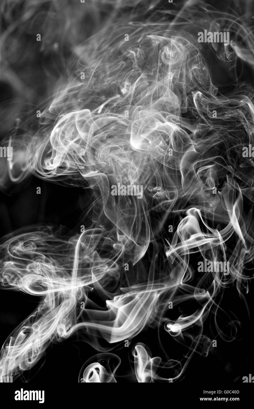 Beautiful smoke on the black background - macro photo Stock Photo - Alamy