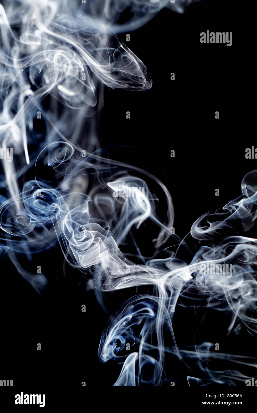 Beautiful smoke on the black background - macro photo Stock Photo - Alamy