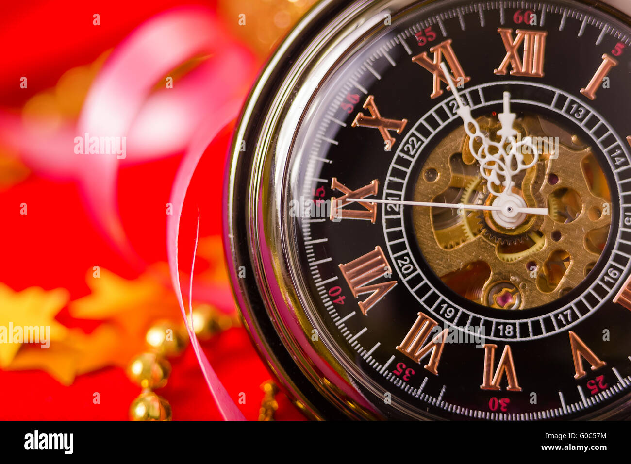 Christmas card. vintage watch on a red background with golden ...