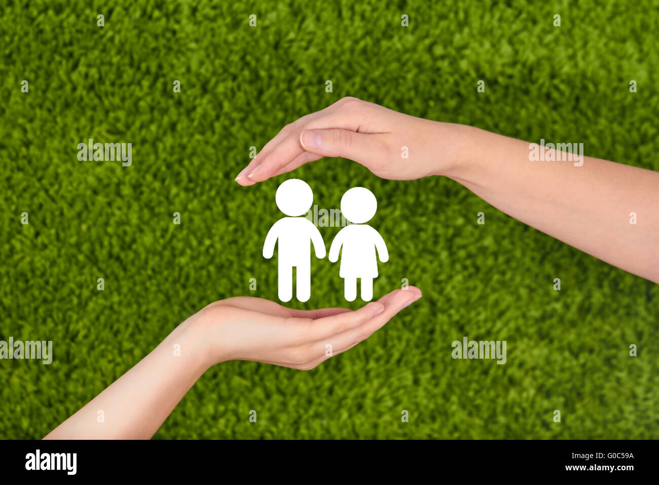 Family life insurance,Protecting Family Stock Photo - Alamy