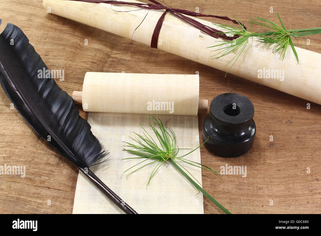 Papyrus scroll with quill Stock Photo - Alamy