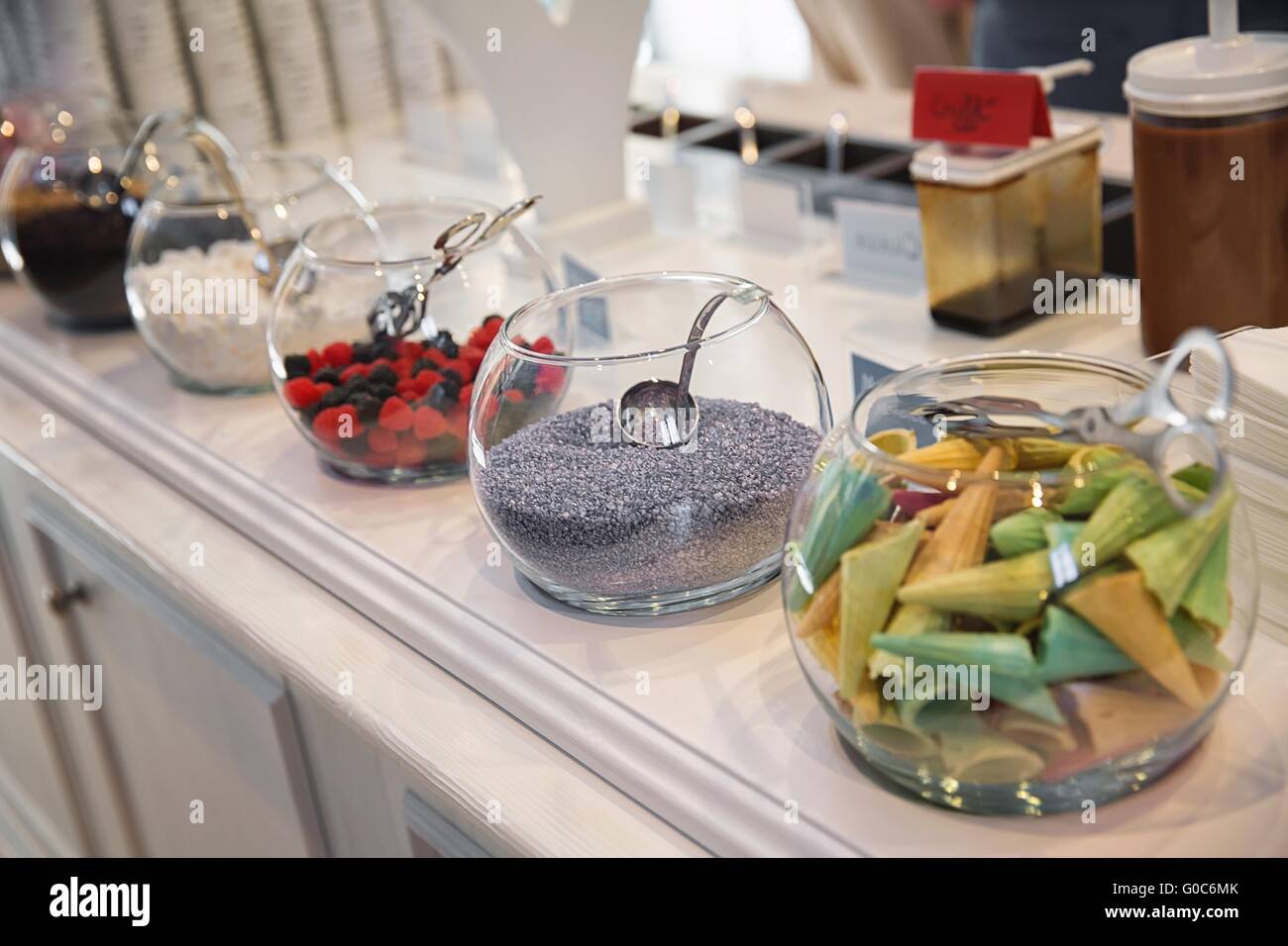 Bowls with candies and treats for decorating various sweet dishes Stock ...