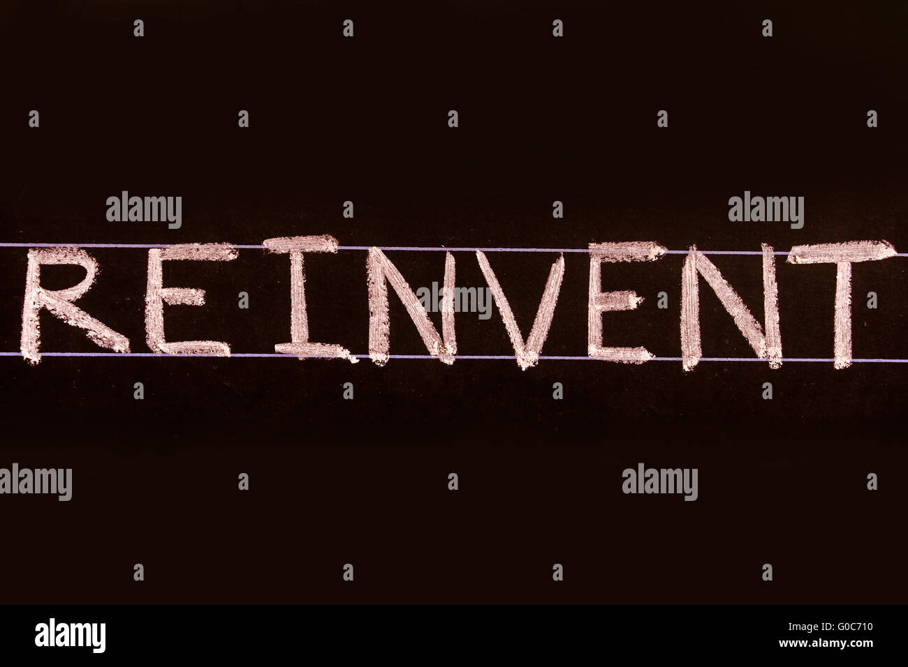 reinvent word handwritten on black chalkboard Stock Photo - Alamy