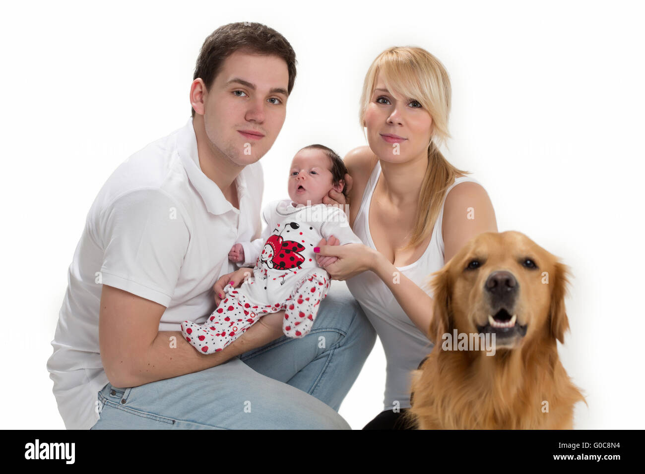 happy young family with newborn and dog on a white background Stock ...