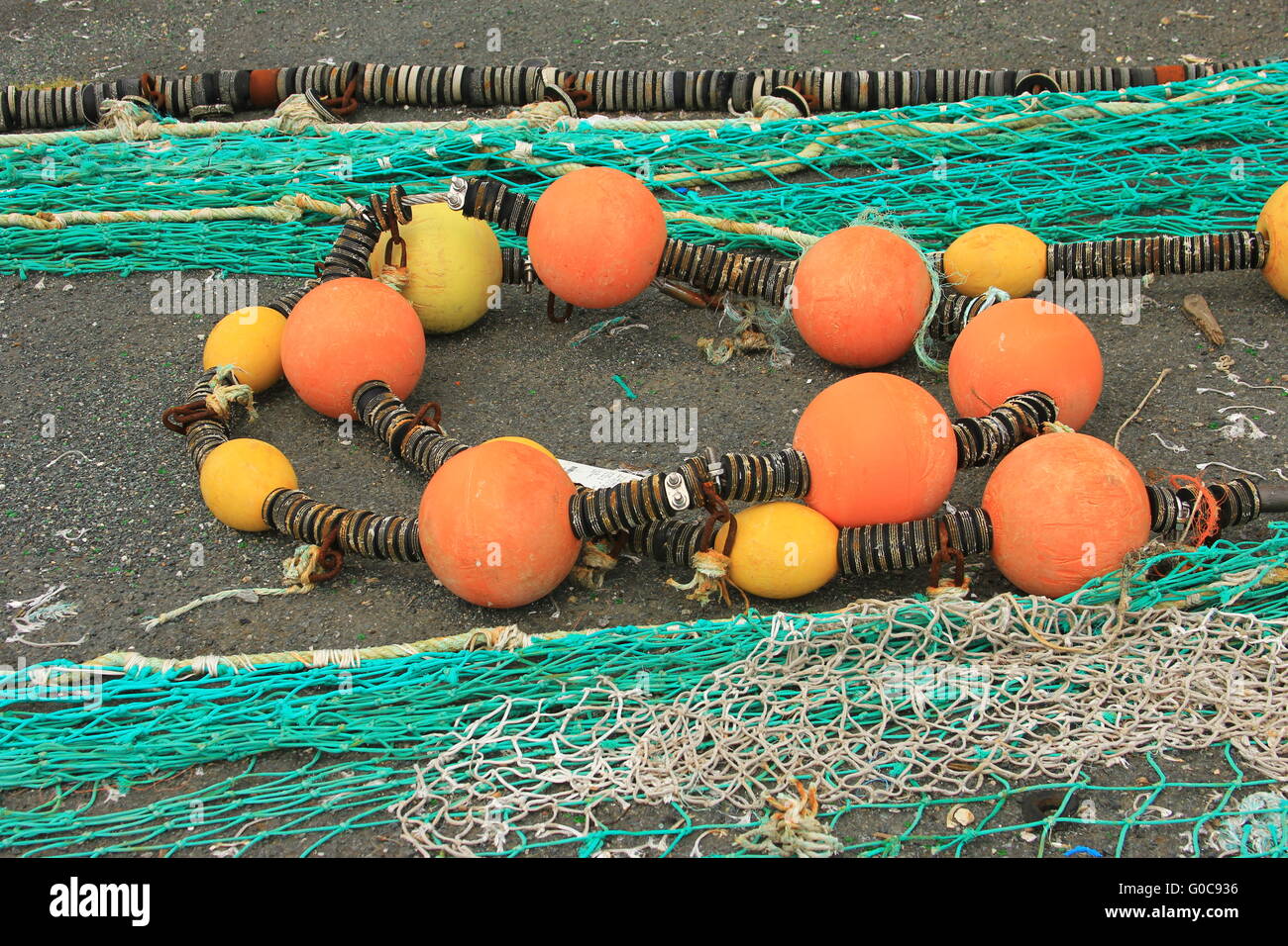 Fishing nets spread on the ground Stock Photo - Alamy