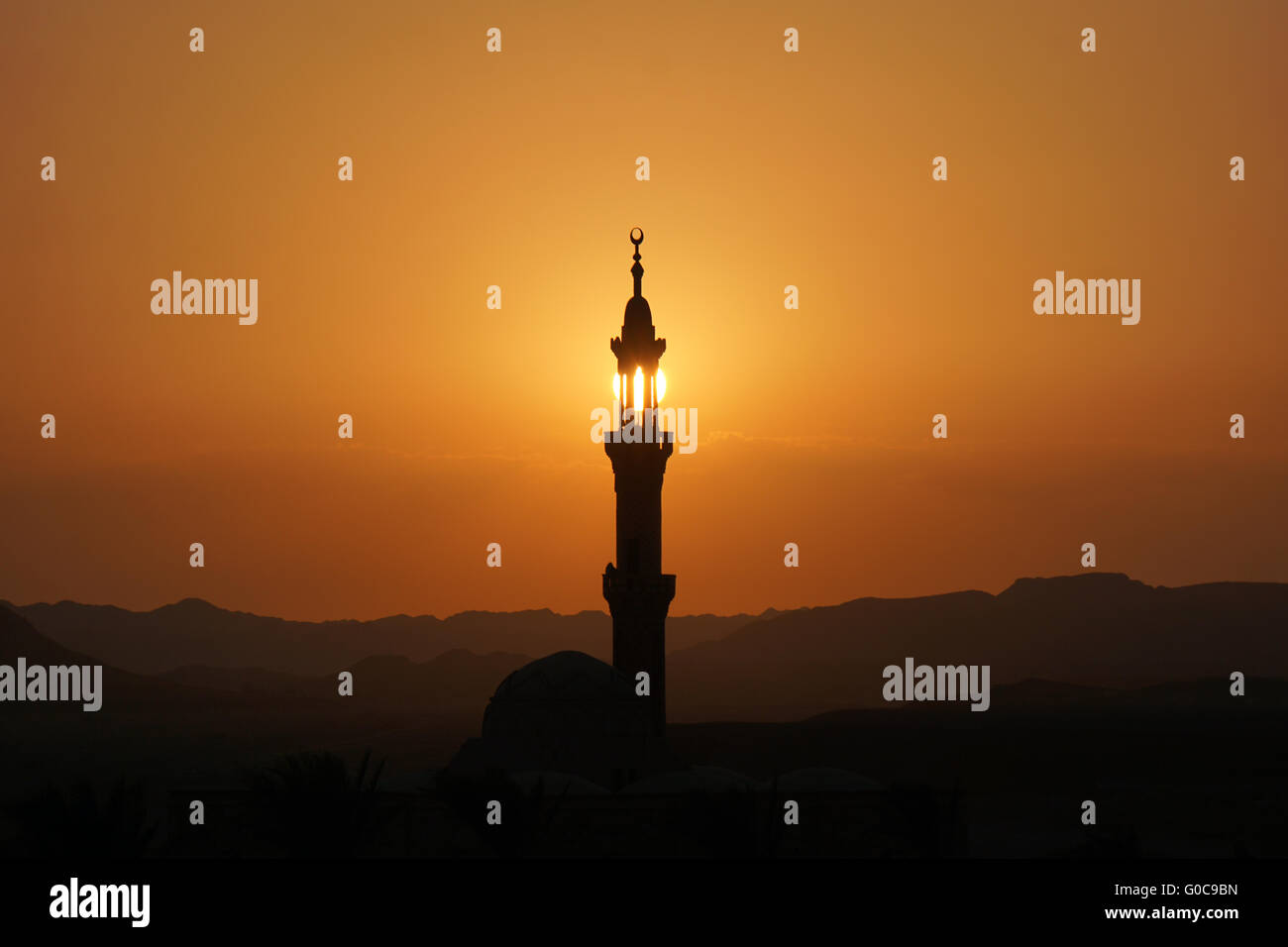sunset over mosque in egypt town of el quesir Stock Photo - Alamy