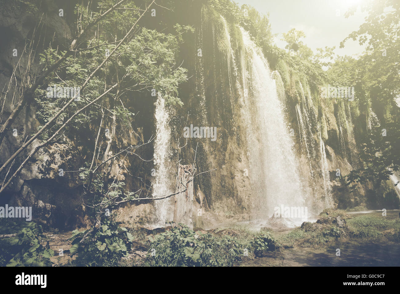 Retro Waterfall with Sunlight with Vintage Film Style Stock Photo - Alamy