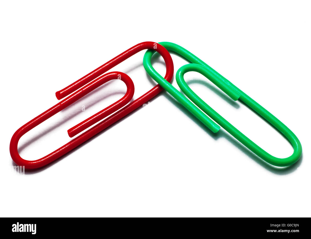 Red and green paper clips, symbolic image Stock Photo - Alamy