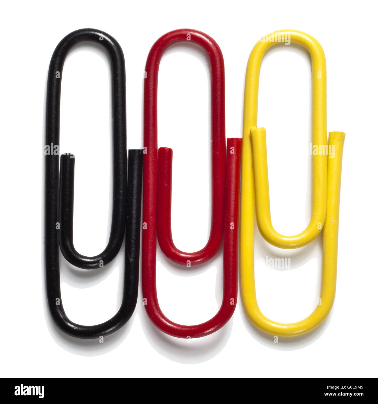 Black, red and yellow paper clips, Germany Stock Photo - Alamy
