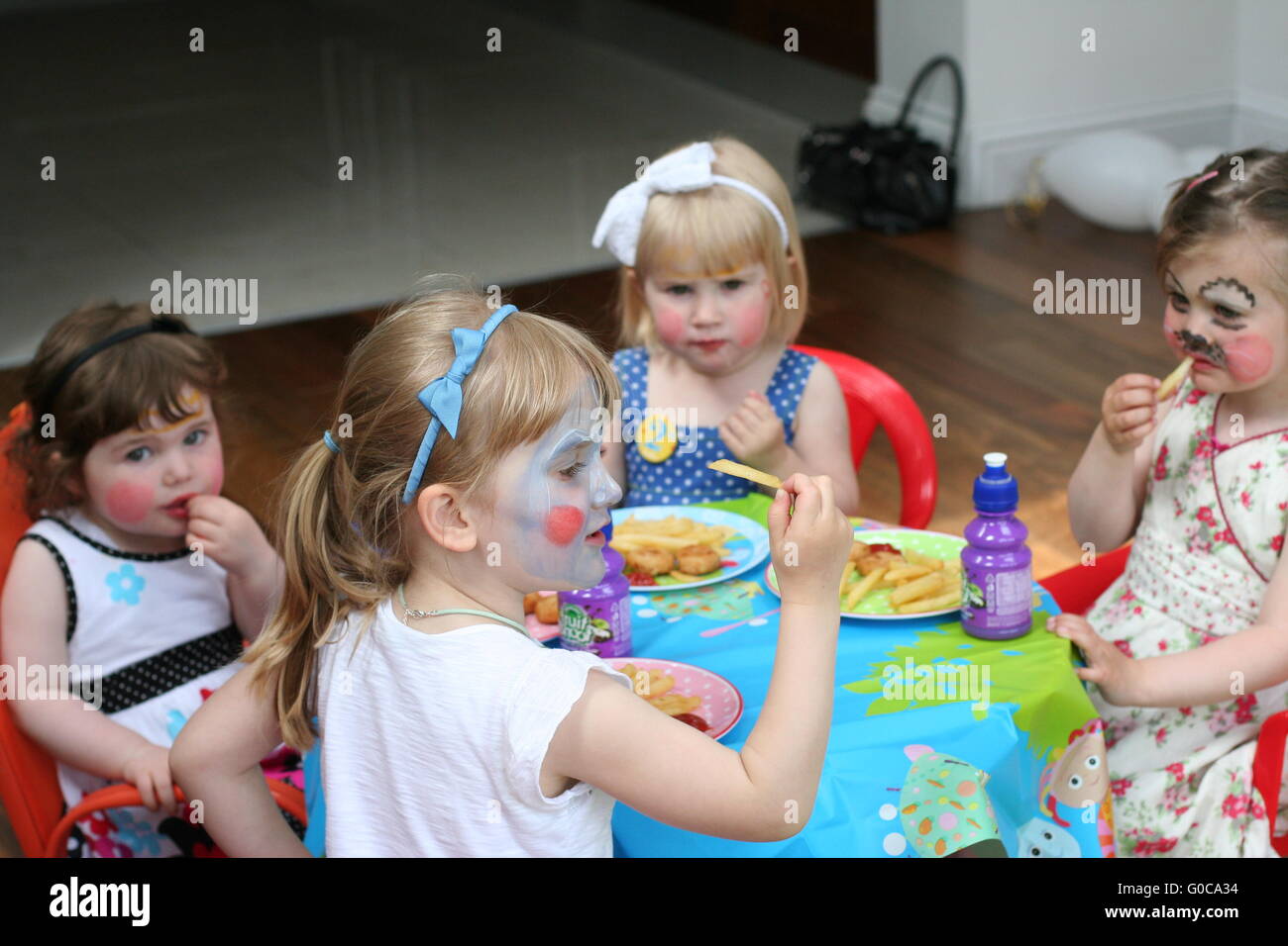 Childrens /Kids birthday party, Children sitting around party table two ...