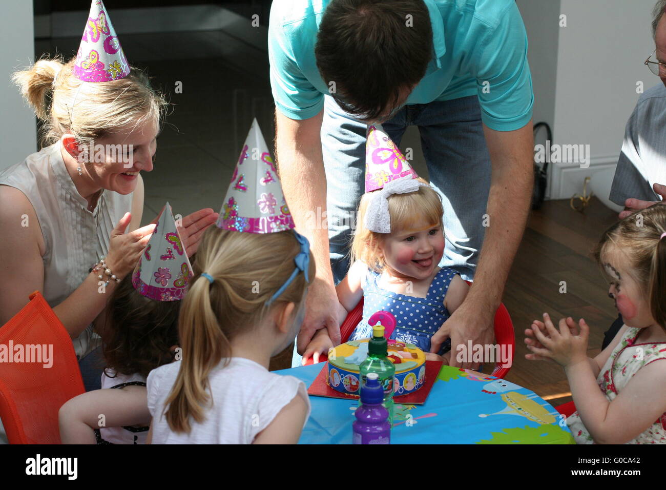 Childrens /Kids birthday party, Children sitting around party table two ...