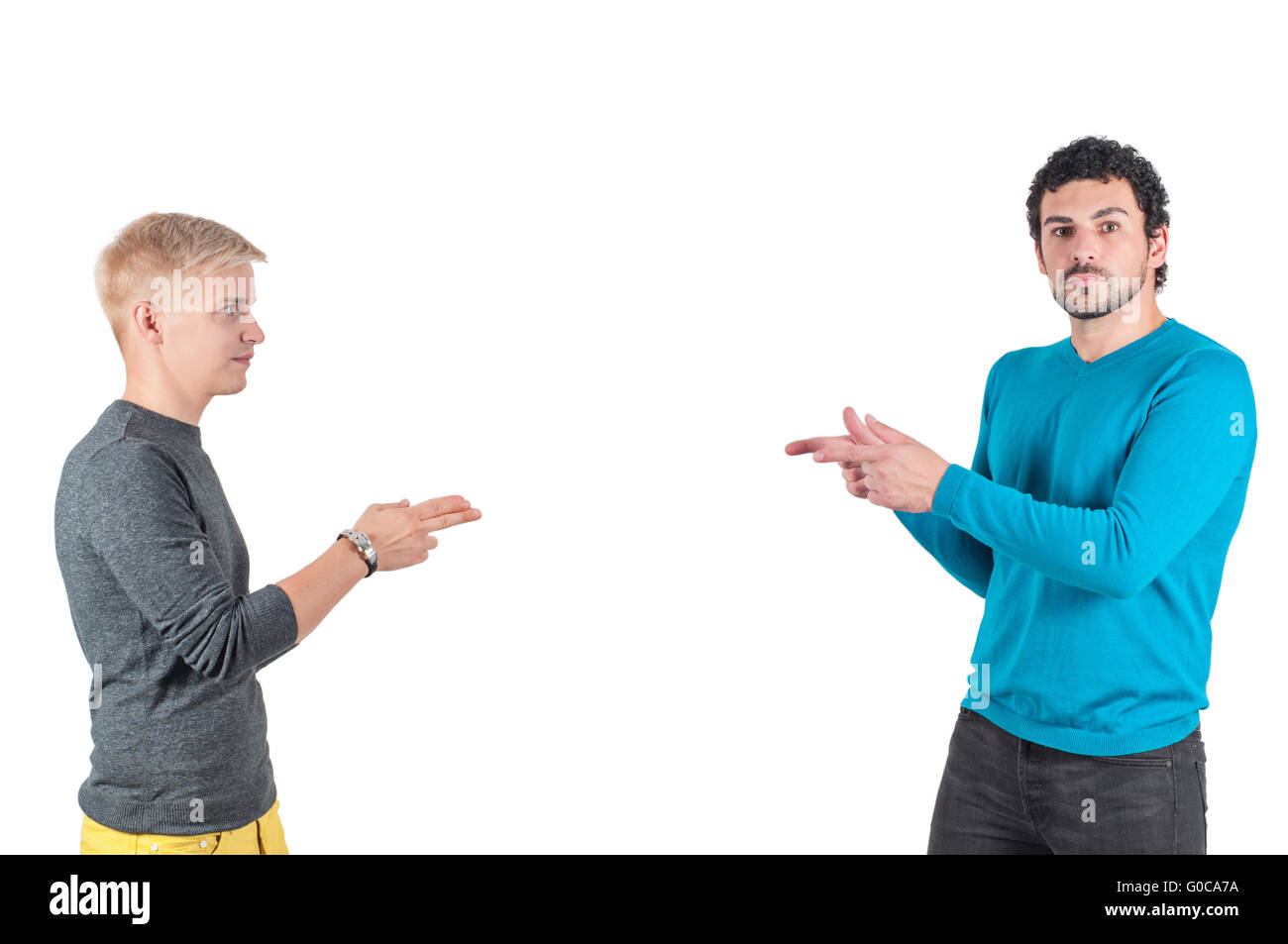 Handsome guys showing on each other with fingers Stock Photo - Alamy