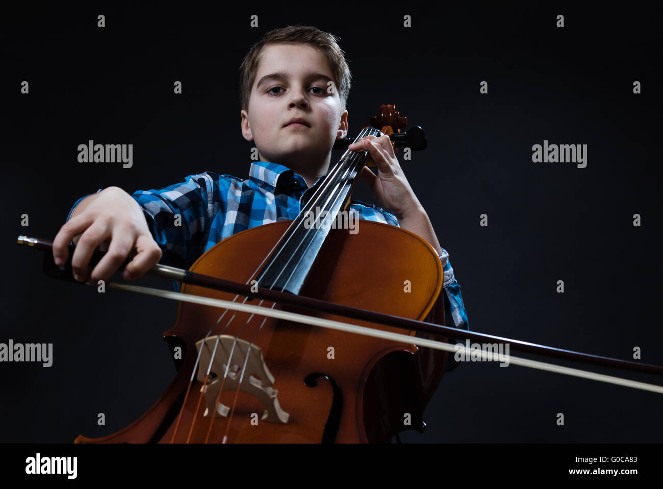 Boy playing cello violoncello hi-res stock photography and images - Alamy