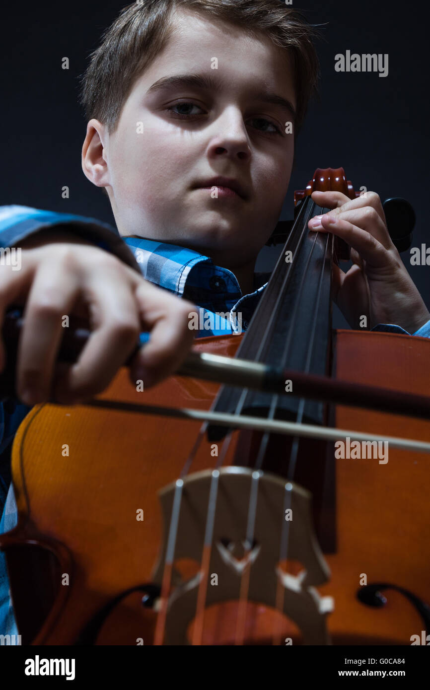 young Cellist playing classical music on cello Stock Photo - Alamy